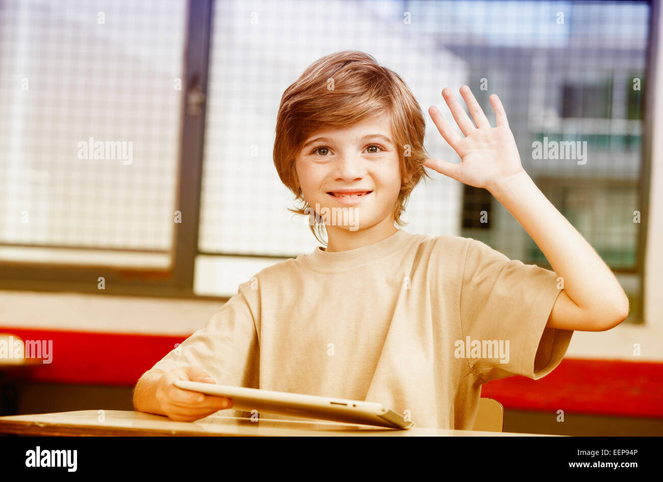 Kids raising hands classroom hi-res stock photography and images - Alamy