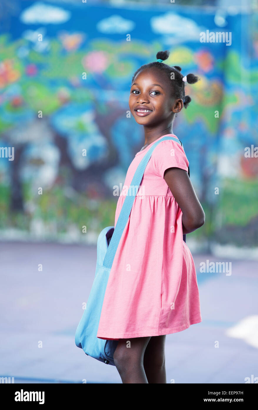 Happy afro american elementary female student entering school Stock ...