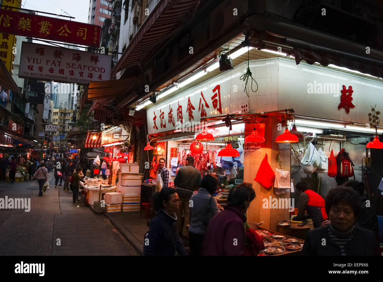 Illuminated supermarket shop front at night in Gage Street, Hong Kong ...