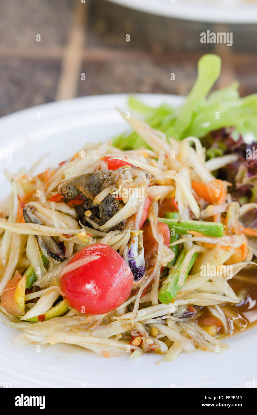 Thai spicy papaya salad serve with vegetables Stock Photo - Alamy