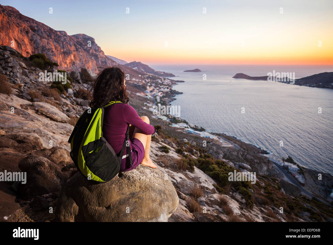Rock climber having rest at sunset Stock Photo - Alamy