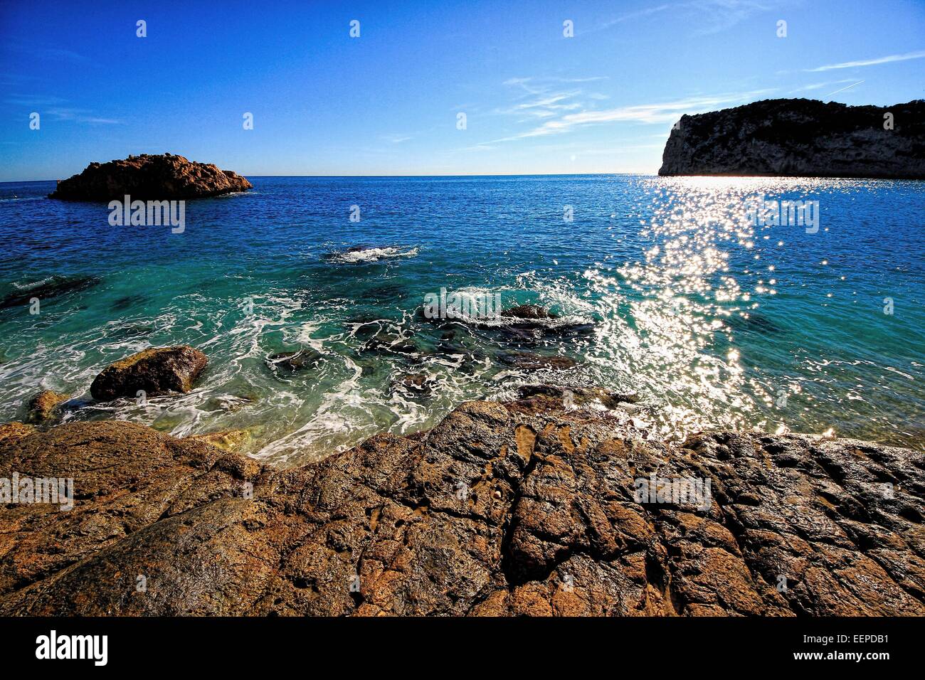 Rocks beach in the coast of Moraira, Spain Stock Photo - Alamy