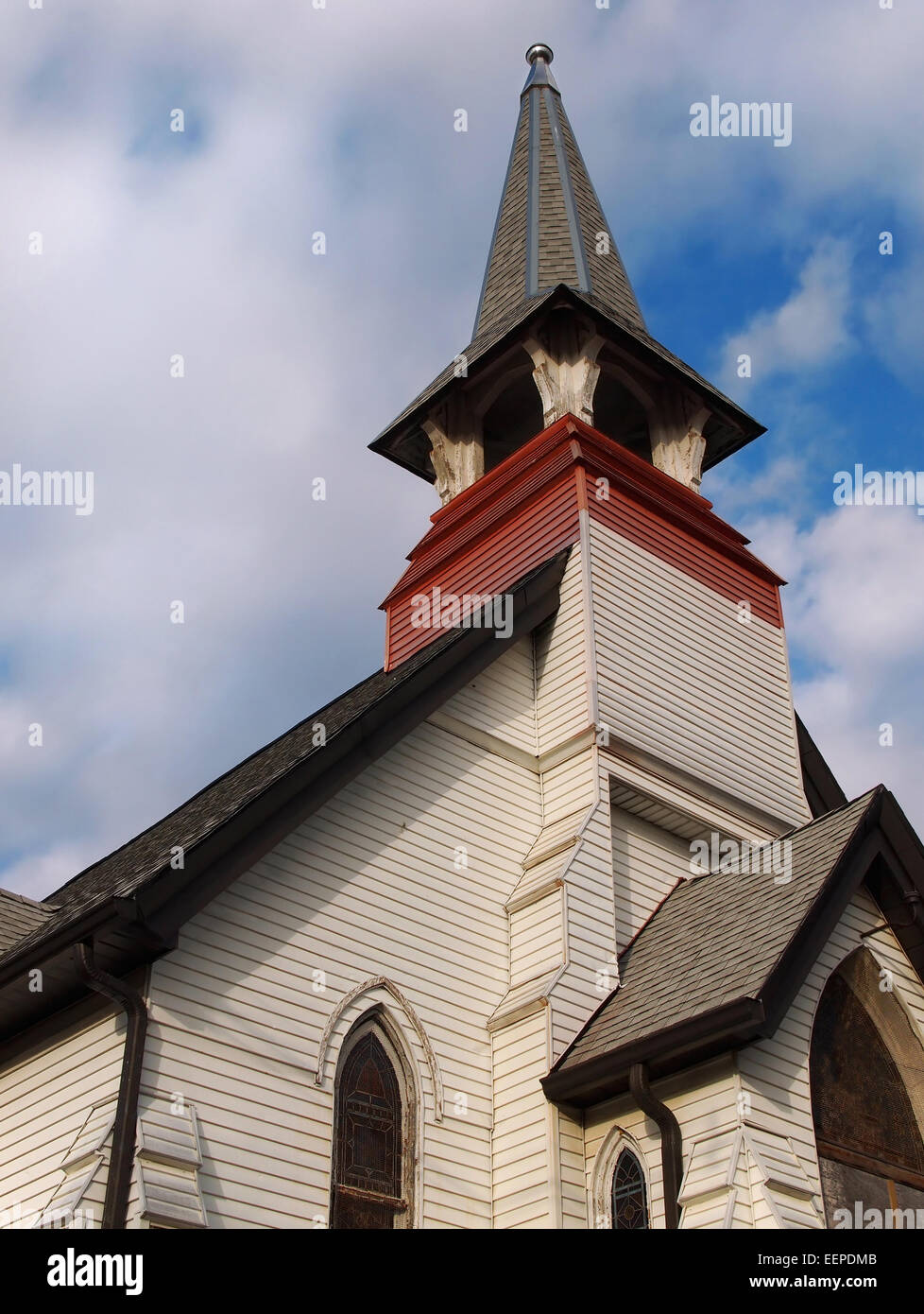 A vintage church steeple atop an old traditional church against the ...