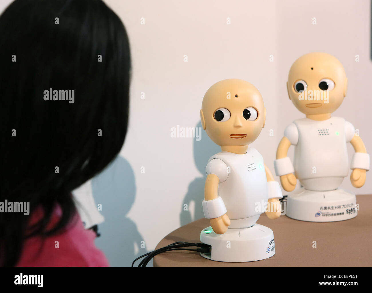 Tokyo, Japan. 20th Jan, 2015. A symbiotic human-robot Otonaroid, left ...