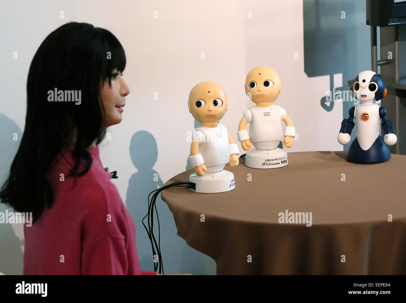 Tokyo, Japan. 20th Jan, 2015. A symbiotic human-robot Otonaroid, left ...