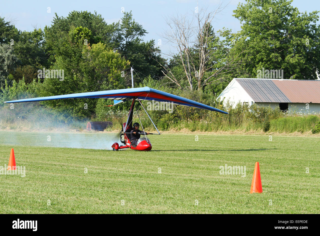 ROSSI model 1+1 Weight-shift-control experimental aircraft. Adult man ...