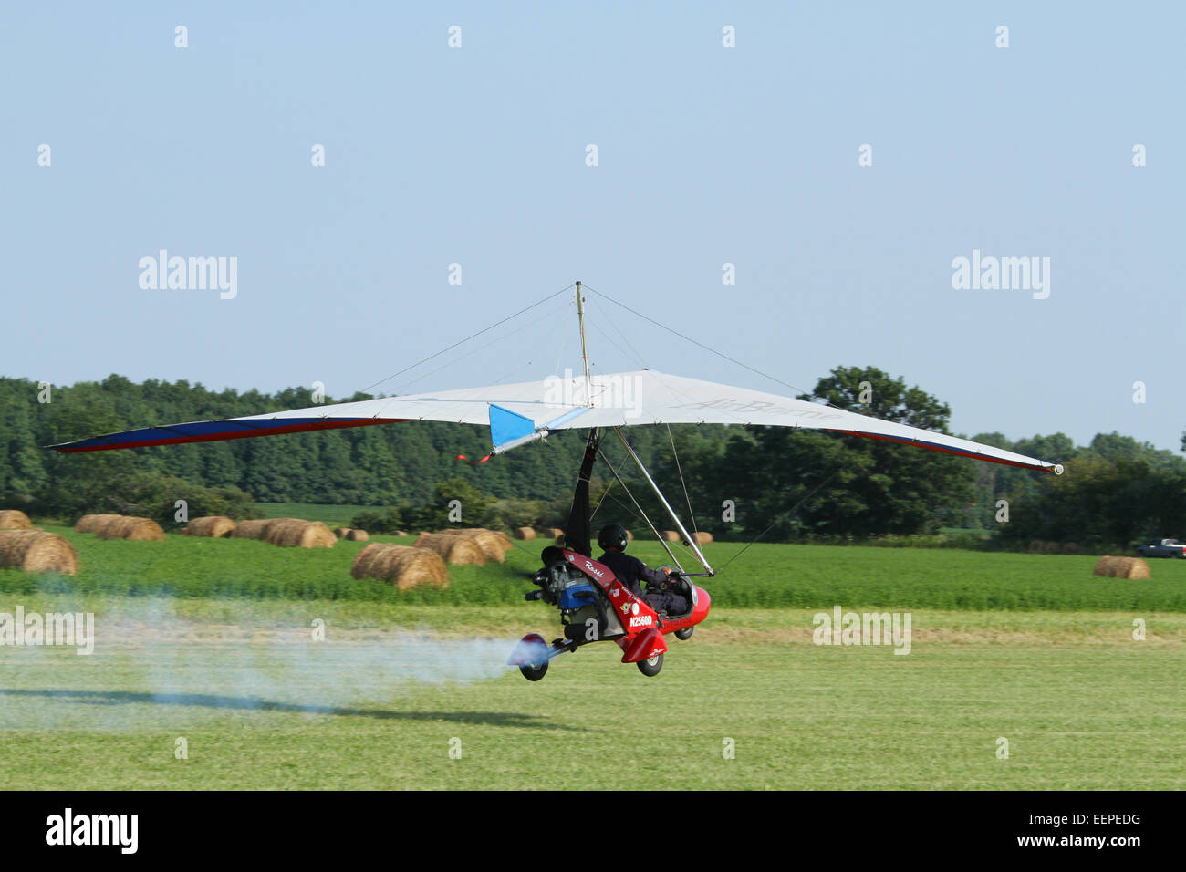 ROSSI model 1+1 Weight-shift-control experimental aircraft. Adult man ...