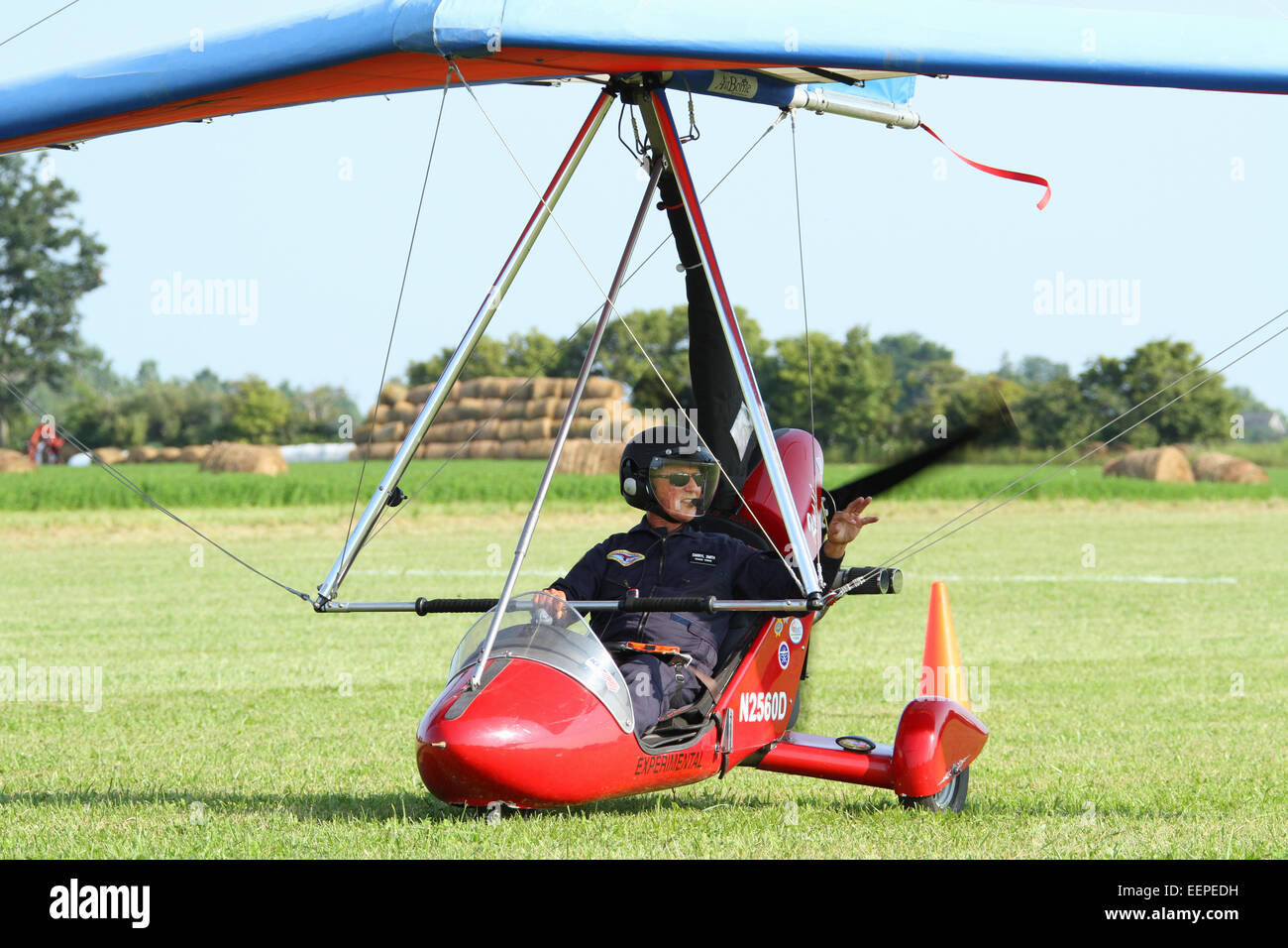 ROSSI model 1+1 Weight-shift-control experimental aircraft. Adult man ...