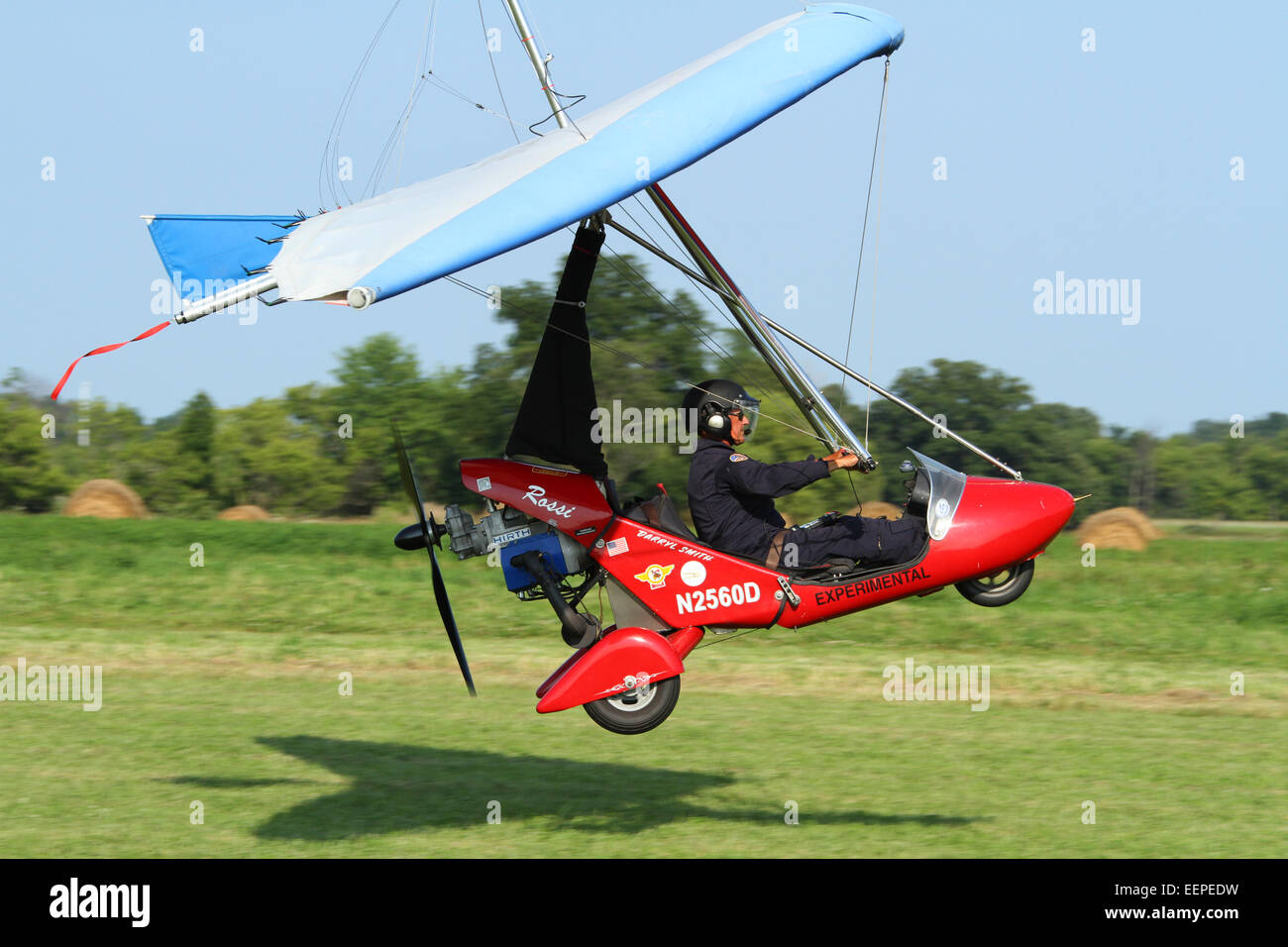 ROSSI model 1+1 Weight-shift-control experimental aircraft. Adult man ...