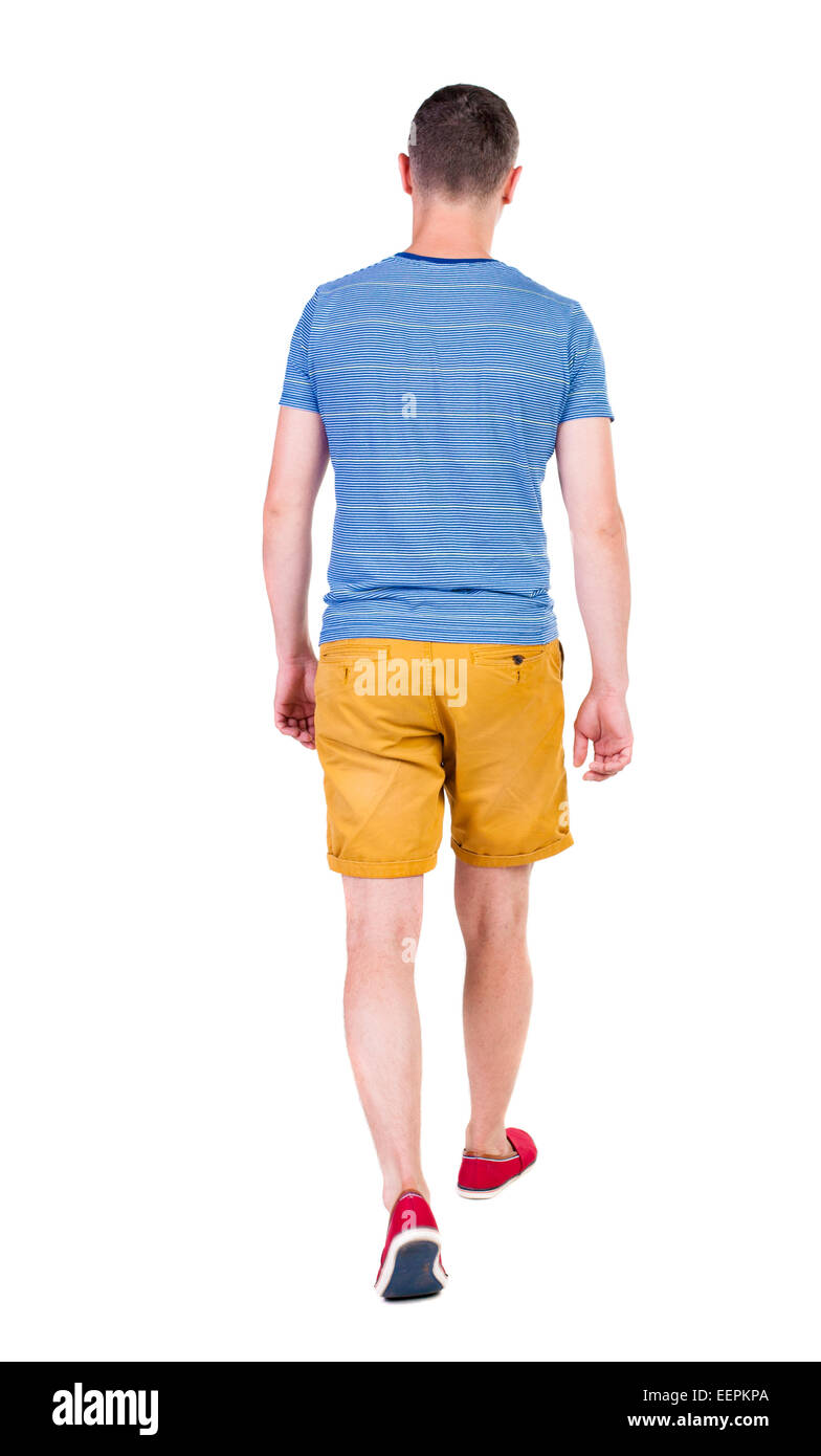 Back view of going handsome man in shorts. walking young guy . Rear ...