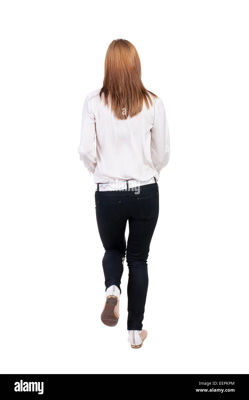 back view of running woman in white shirt. beautiful blonde girl in ...