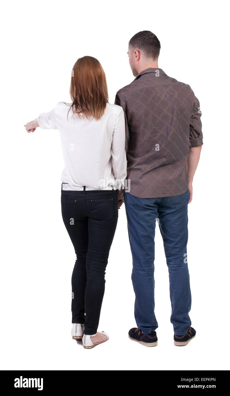 young couple pointing. Back view. Rear view people collection. backside ...