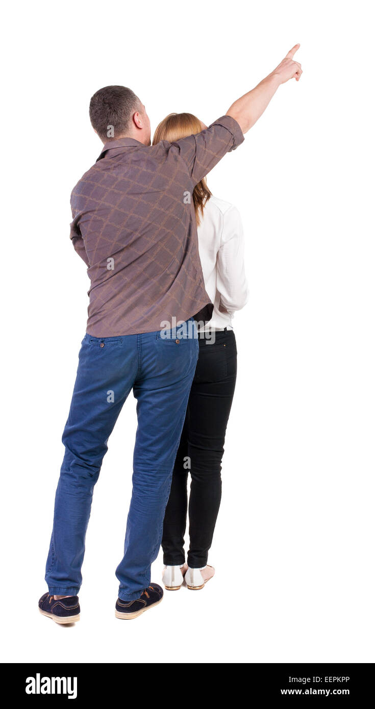 young couple pointing. Back view. Rear view people collection. backside ...
