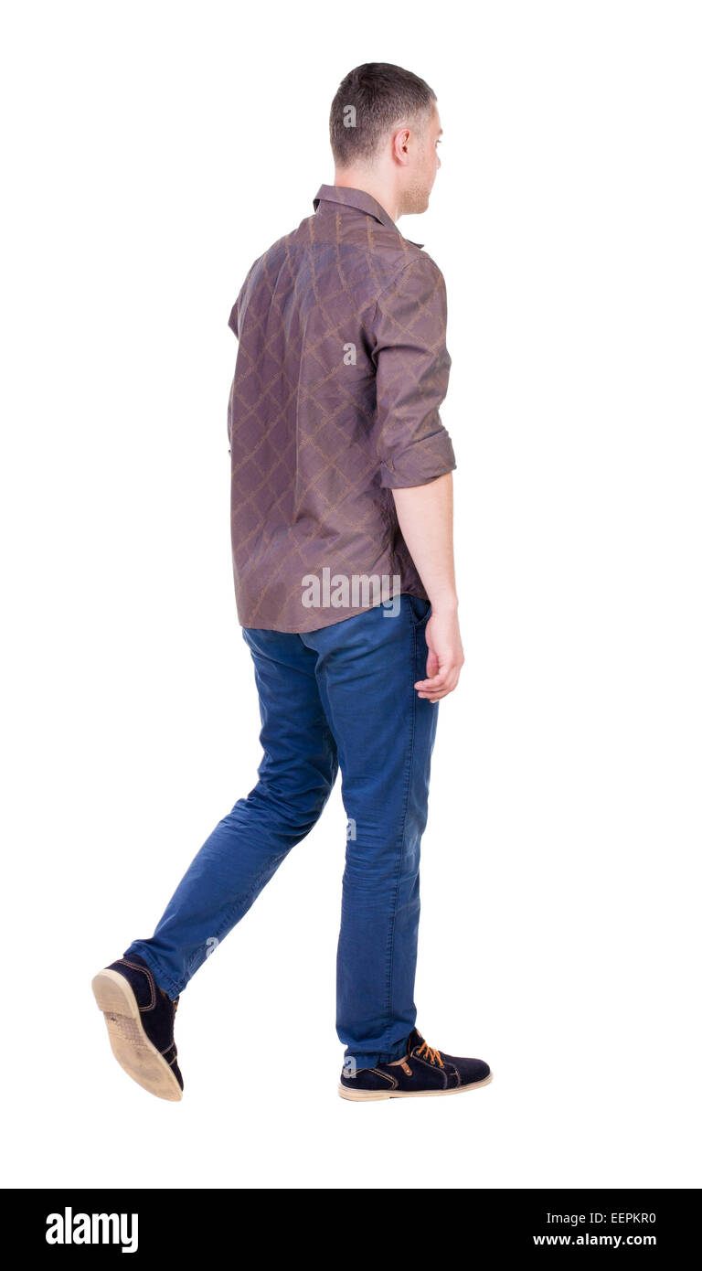 Back view of going handsome man in jeans and a shirt. walking young guy ...