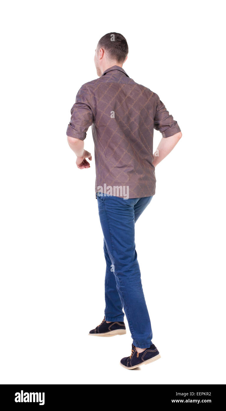 Back view of running man in brown shirt. Walking guy in motion. Rear ...