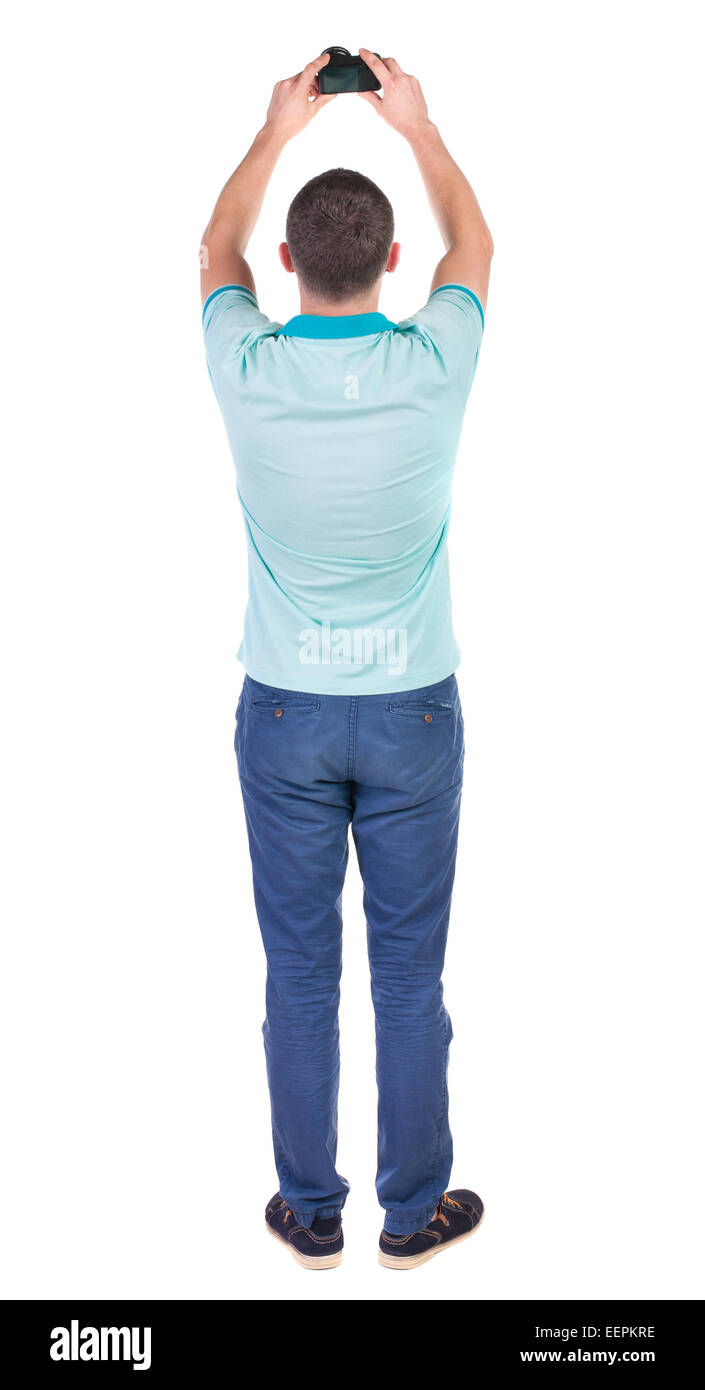 Back view of man photographing. tourist with camera. Rear view people ...