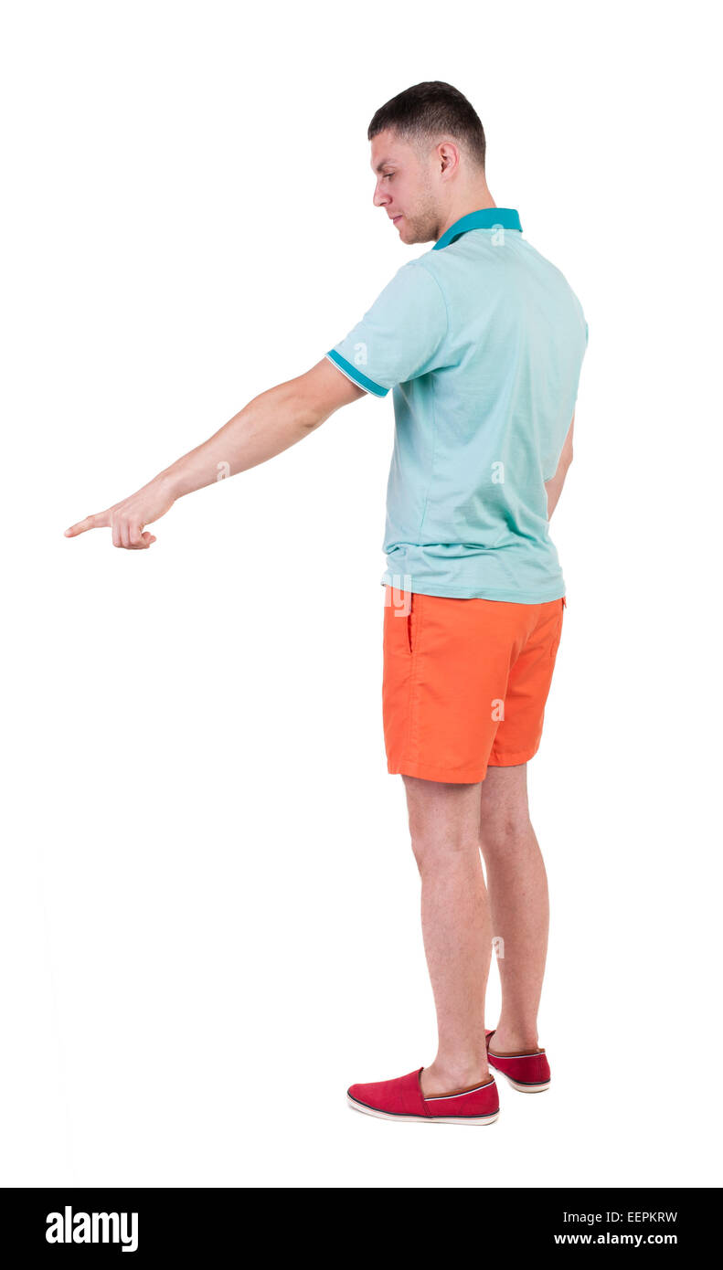 Back view of pointing young men in t-shirt and shorts. Young guy ...
