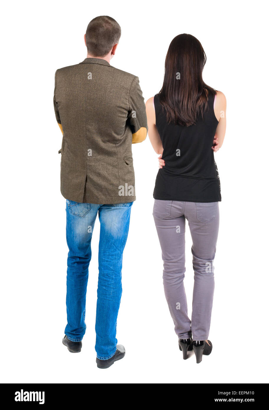 Back view of young couple (man and woman) hug and look into the ...