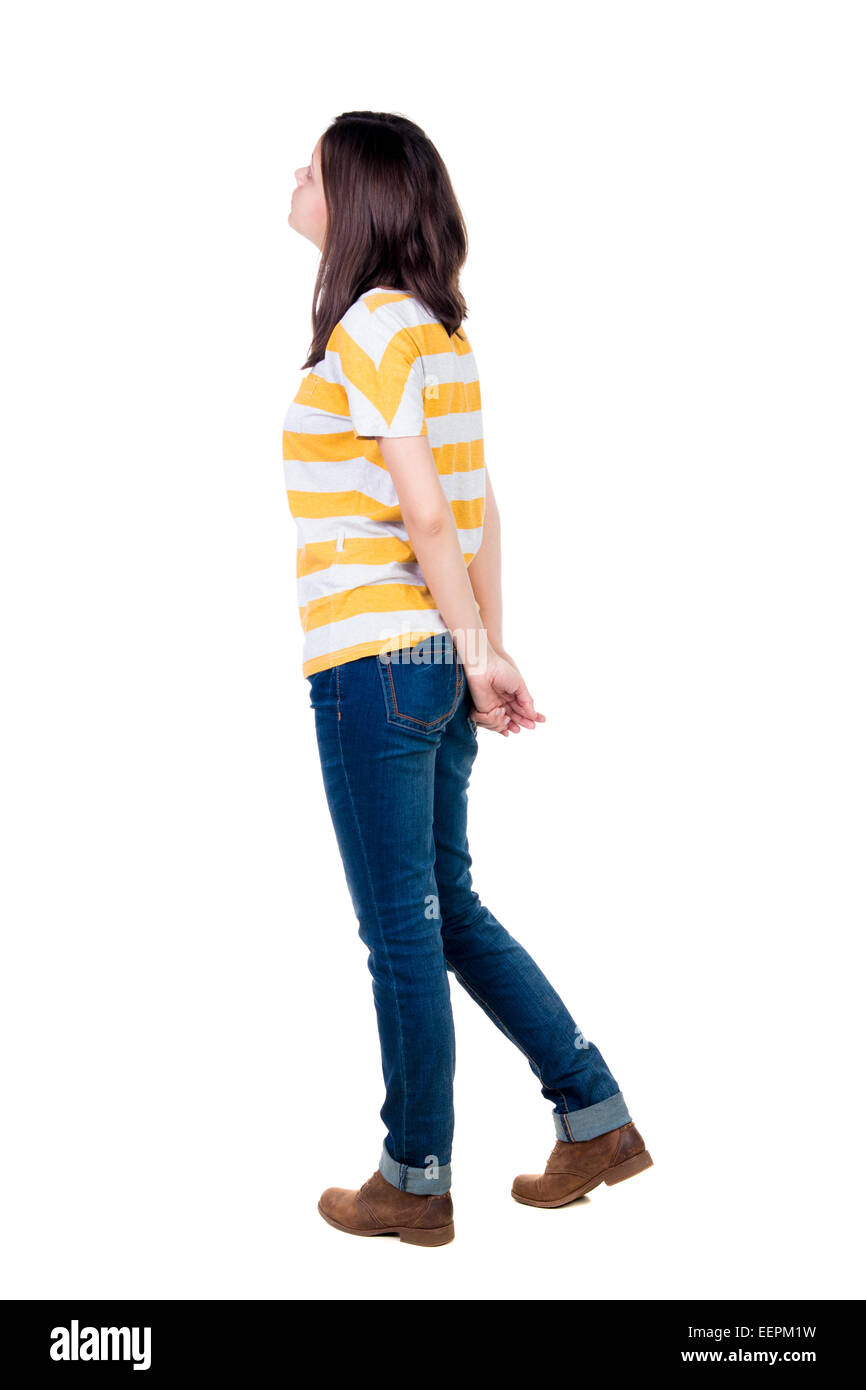 back view of standing young beautiful brunette woman. girl watching ...