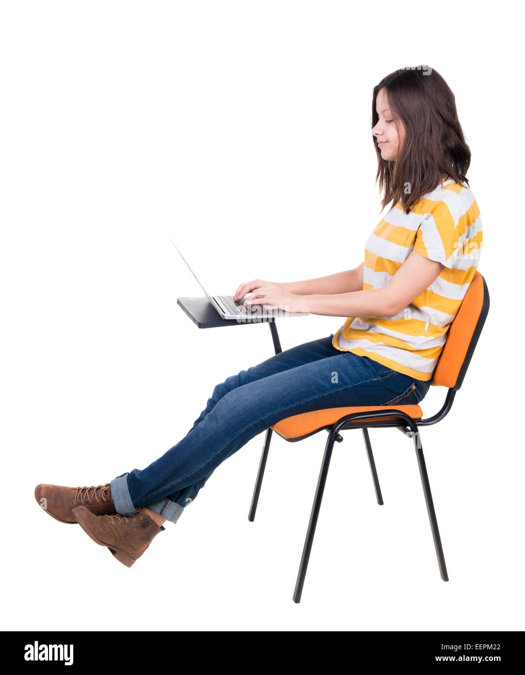 Side view of woman sitting on a chair to study with a laptop. Isolated ...