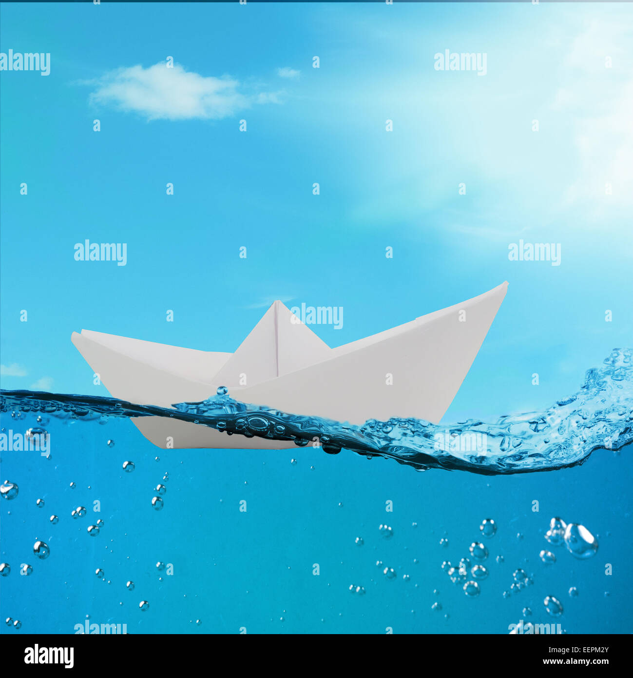 paper boat floating among the waves in the ocean. origami boat floating ...