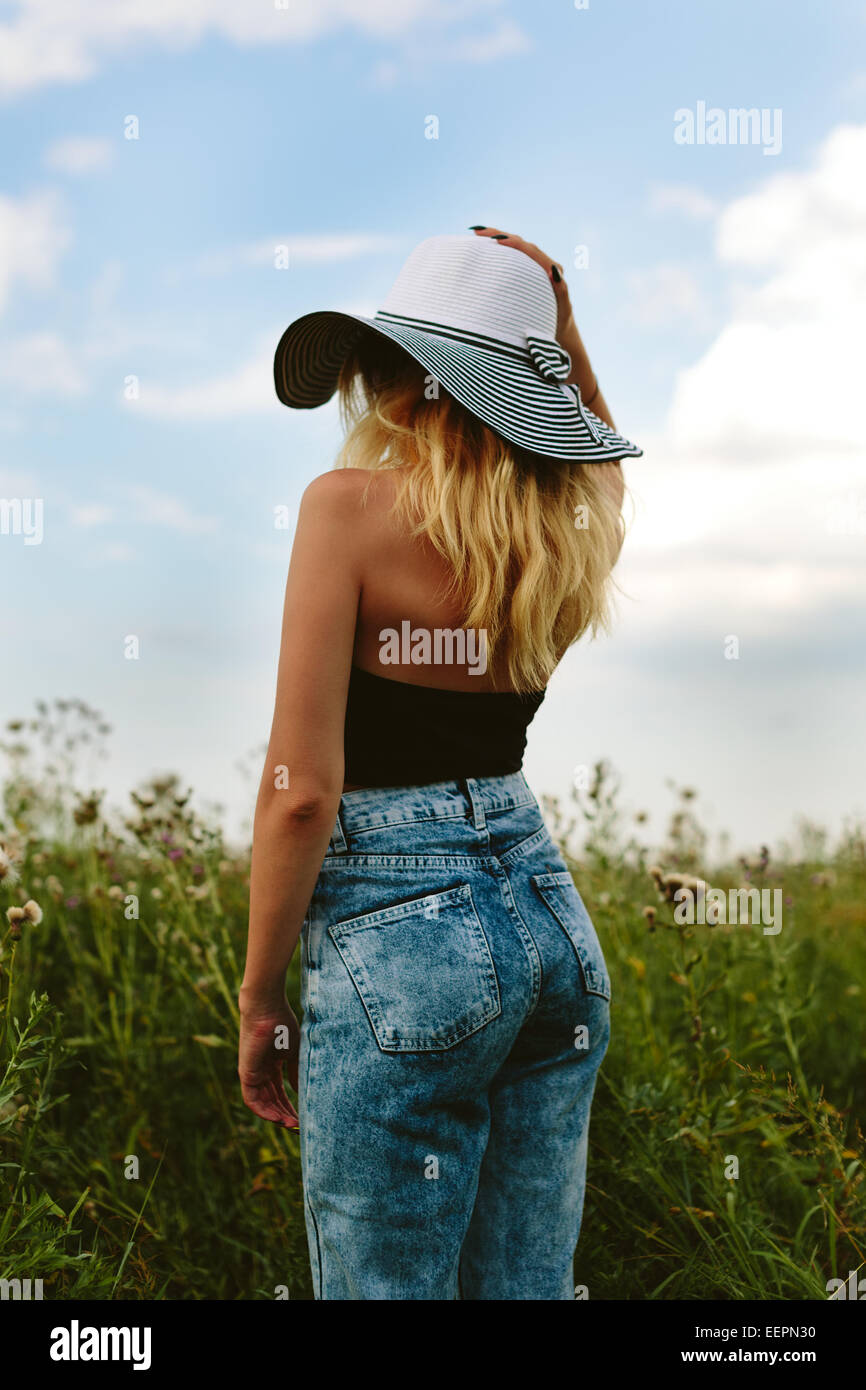 Girl is standing back Stock Photo - Alamy