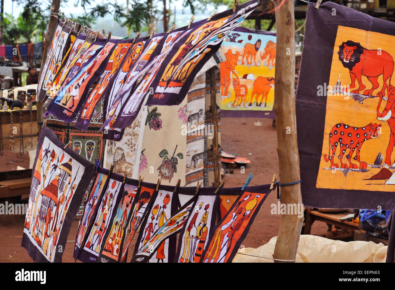 Rows of colourful Batik artworks hanging on line at Swazi craft market ...