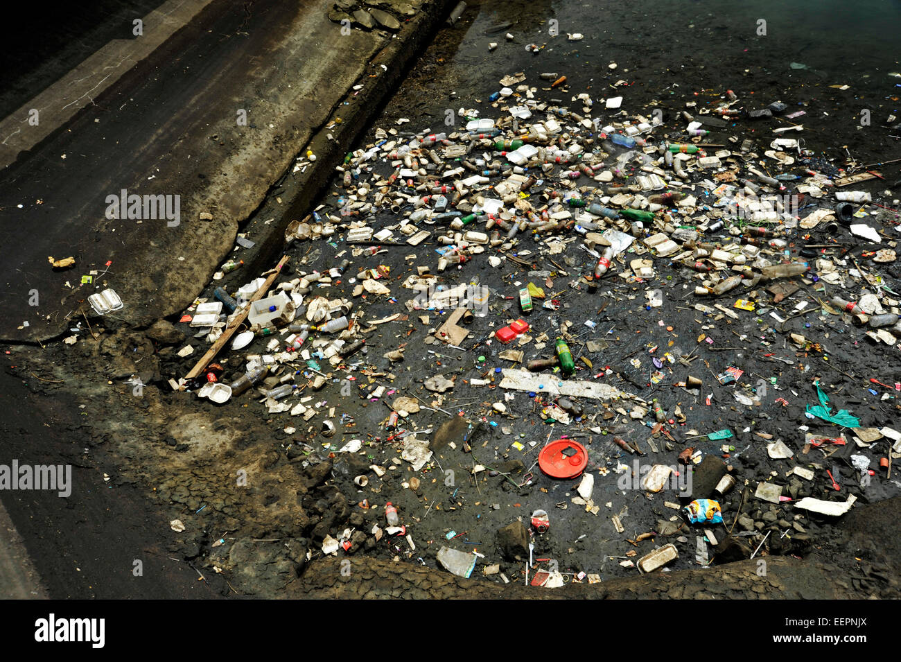 Scene of accumulated plastic packaging pollution floating in dirty ...