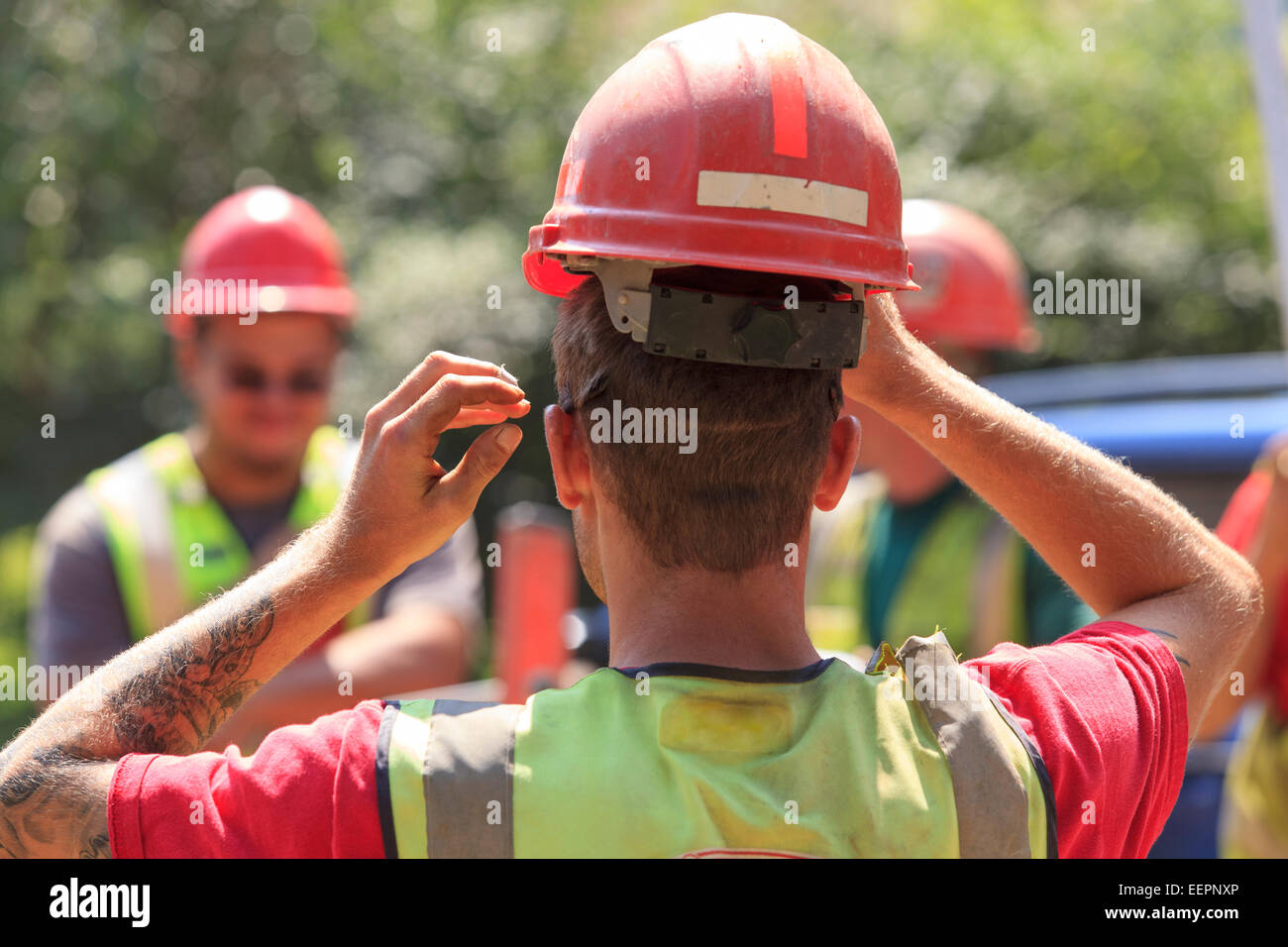 Construction workers taking a break Stock Photo - Alamy