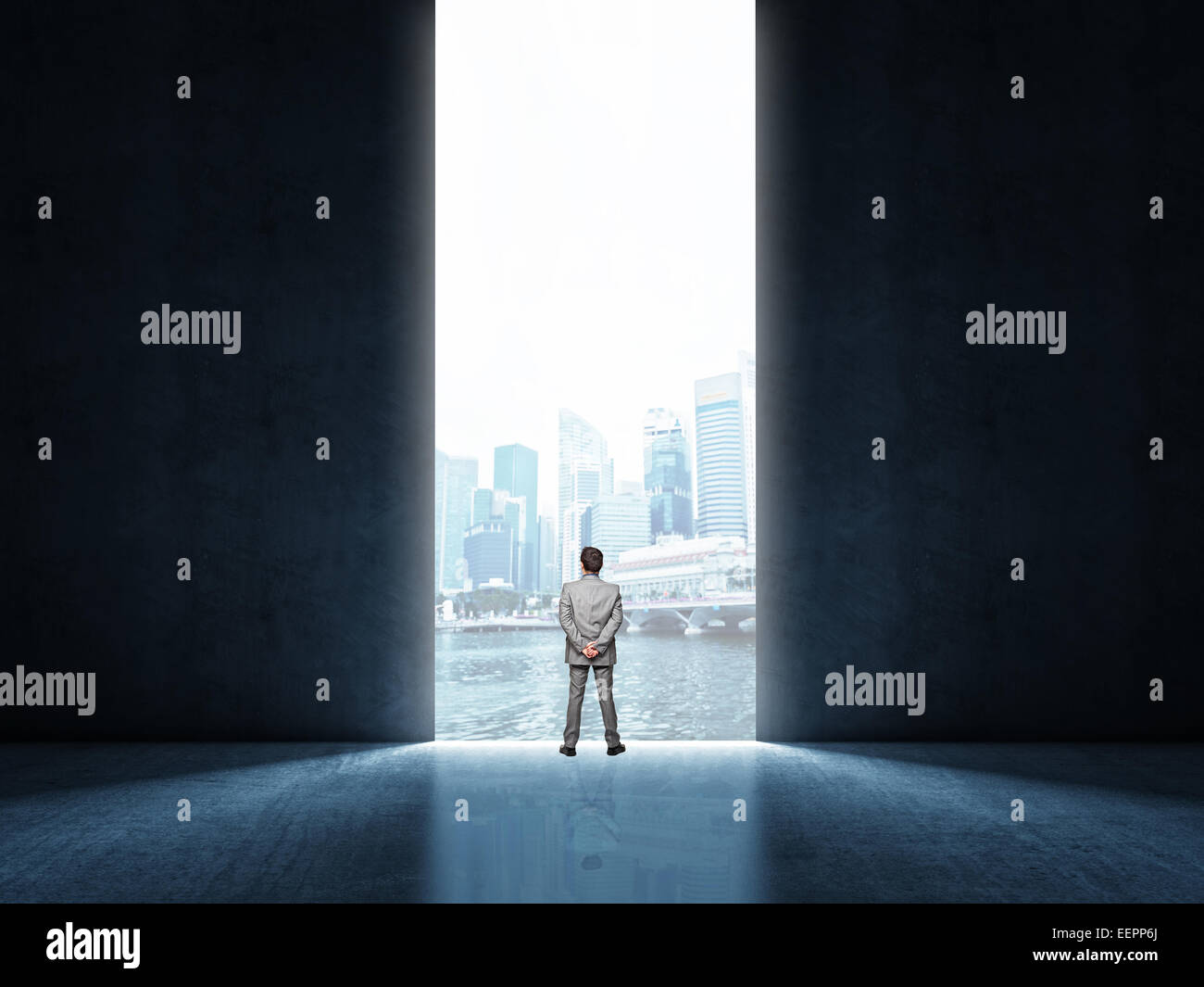 standing man and abstract huge gate Stock Photo - Alamy