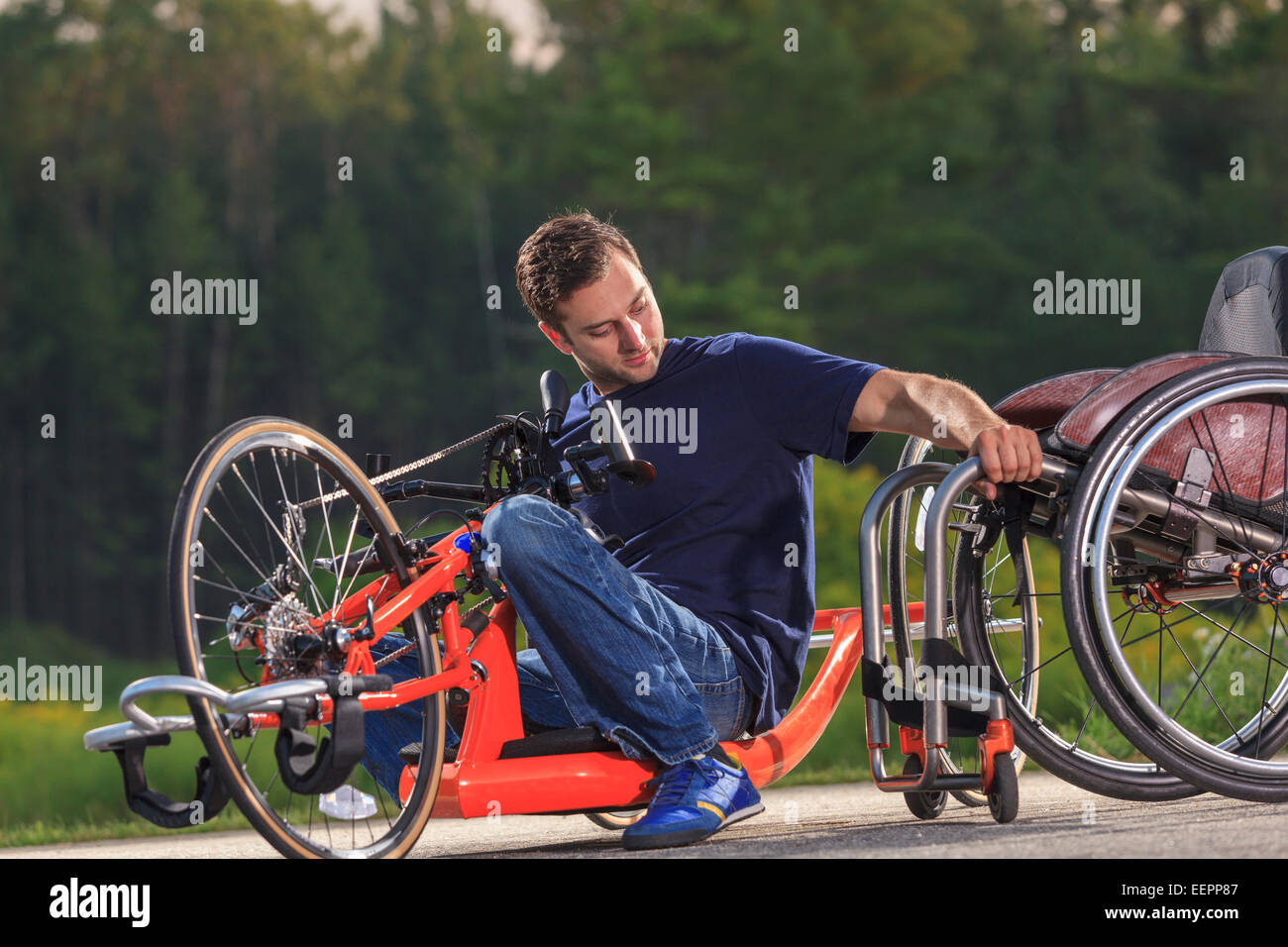 Man with spinal cord injury in his custom adaptive hand cycle getting ...
