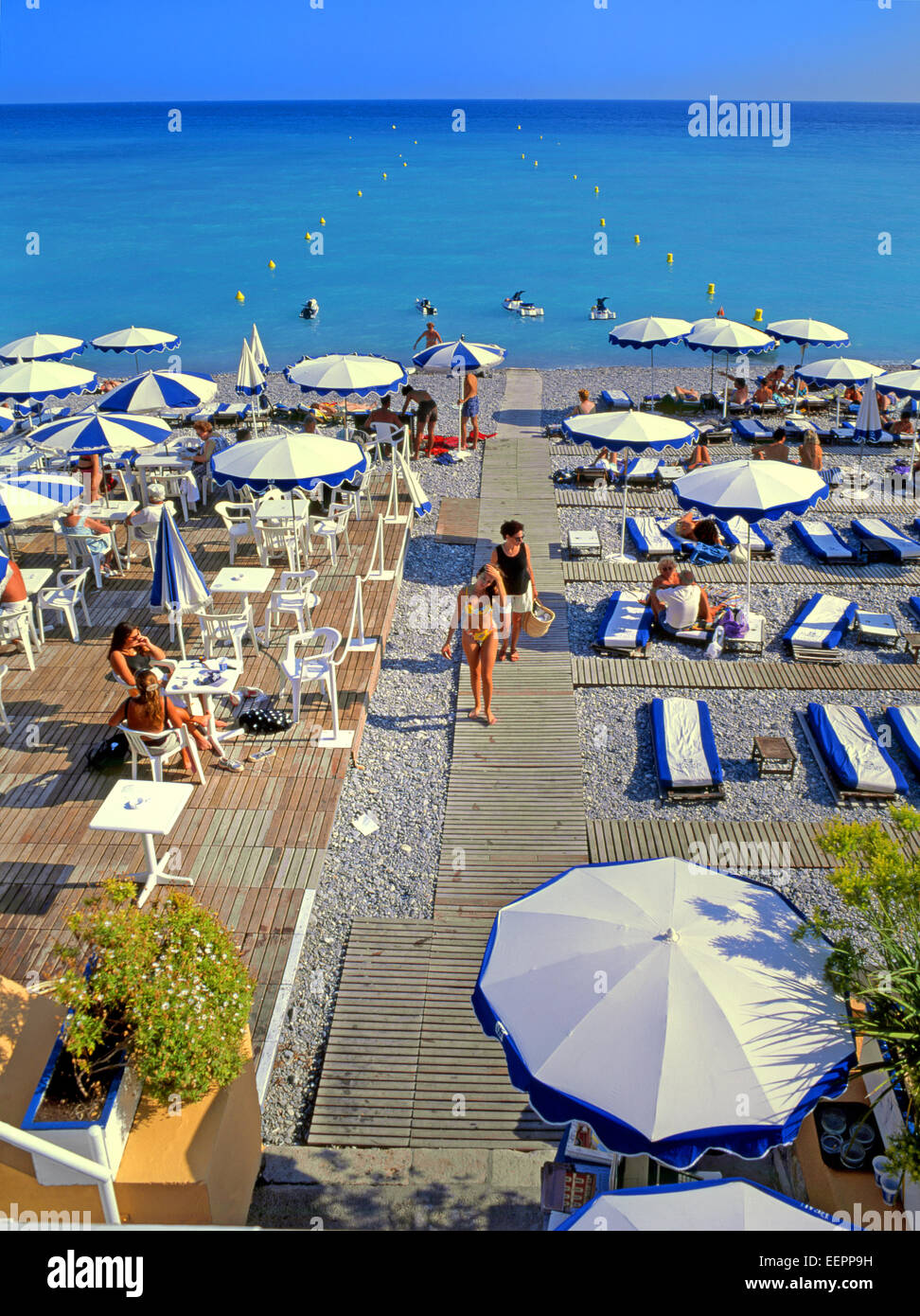 Nice, Cote d'Azure, France. People sunbathing on private hotel beach ...
