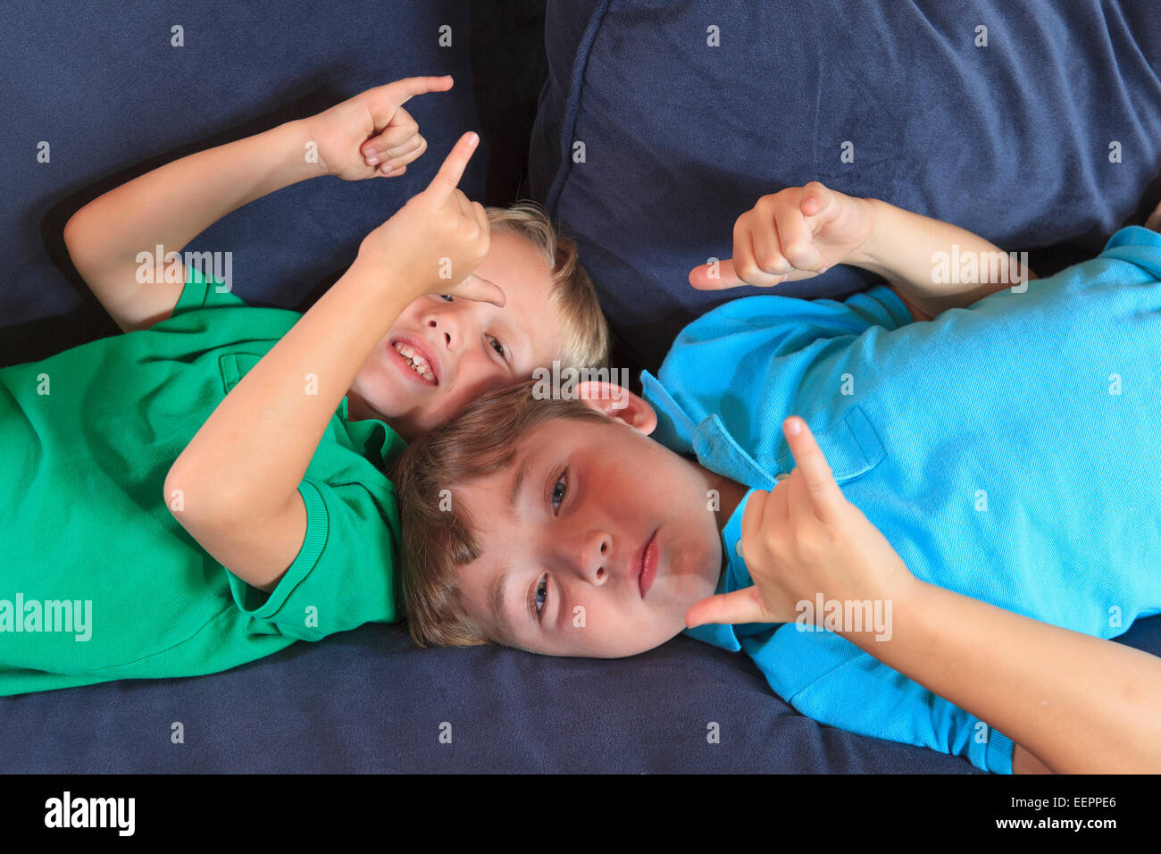 Boys with hearing impairments signing 'play' in American sign language ...