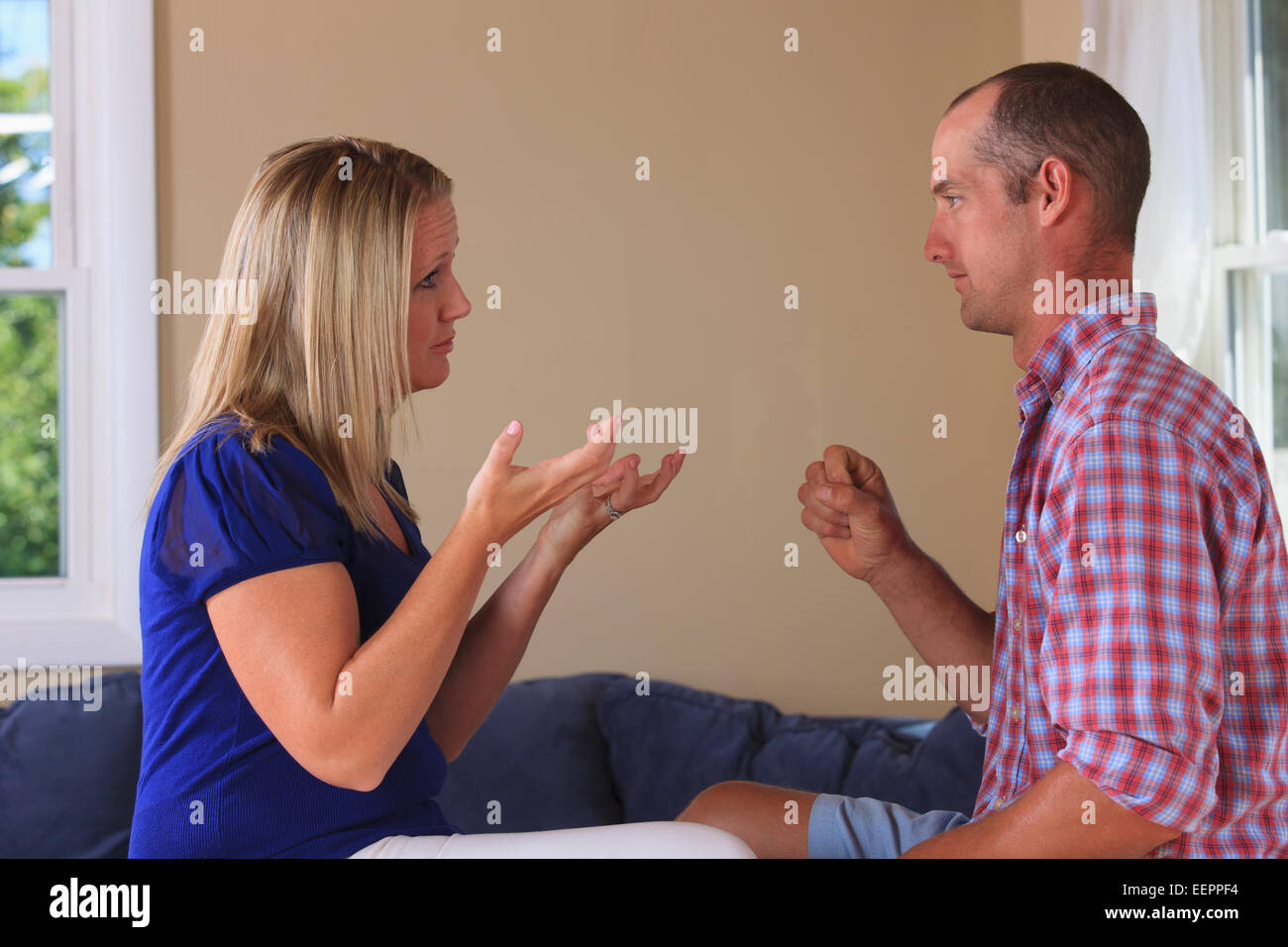 Husband and wife with hearing impairments signing 'Want, Yes' in ...