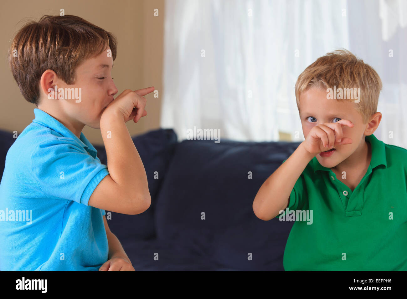 Boys with hearing impairments signing 'bird' in American sign language ...