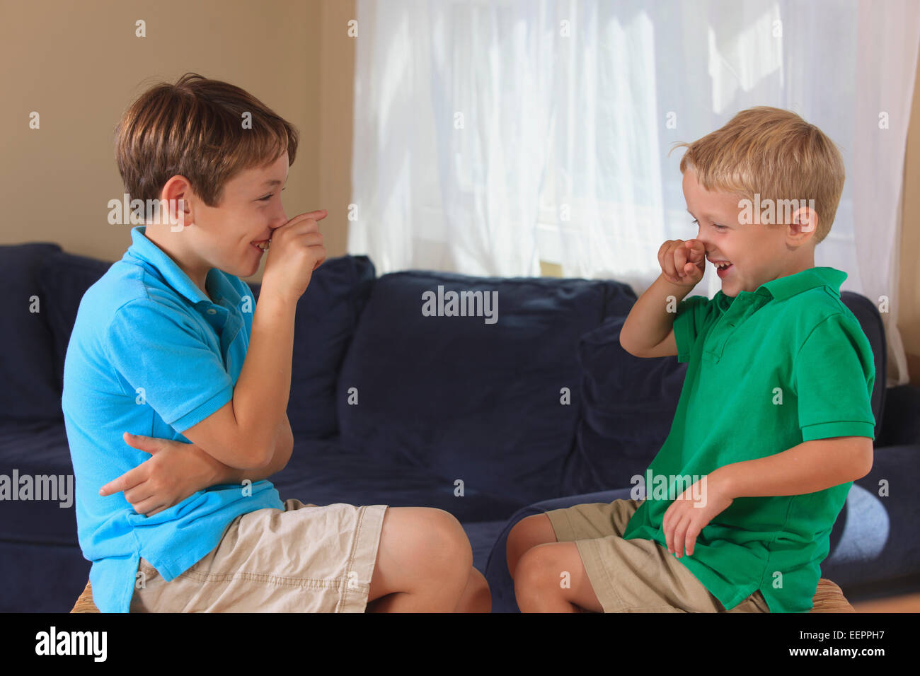 Boys with hearing impairments signing 'bird' in American sign language ...