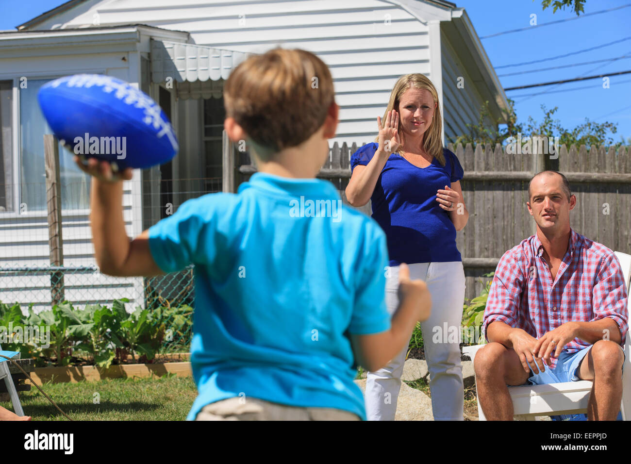 Boys playing football in yard hi-res stock photography and images - Alamy