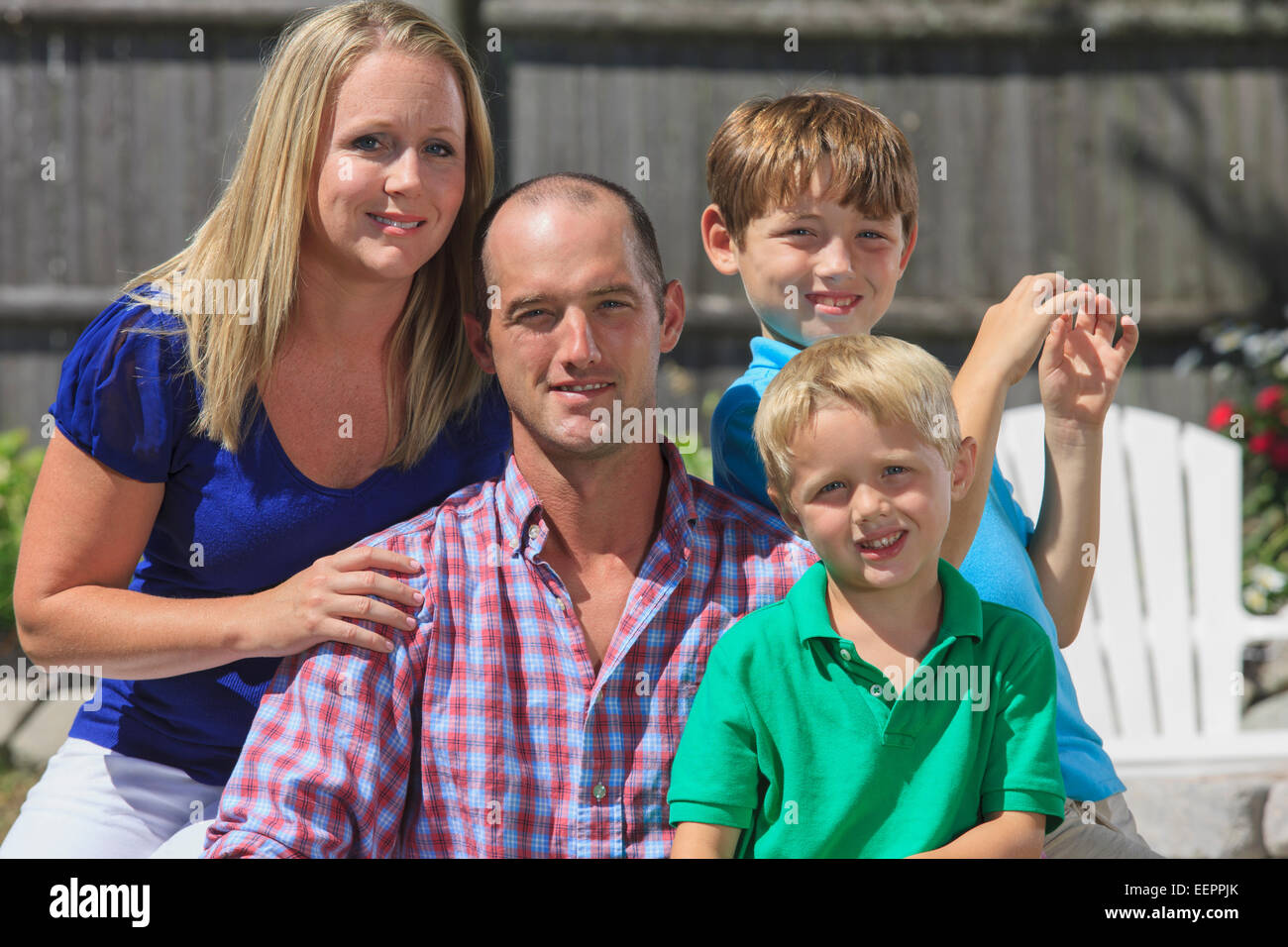 Portrait of a happy family with hearing impairments signing in American ...