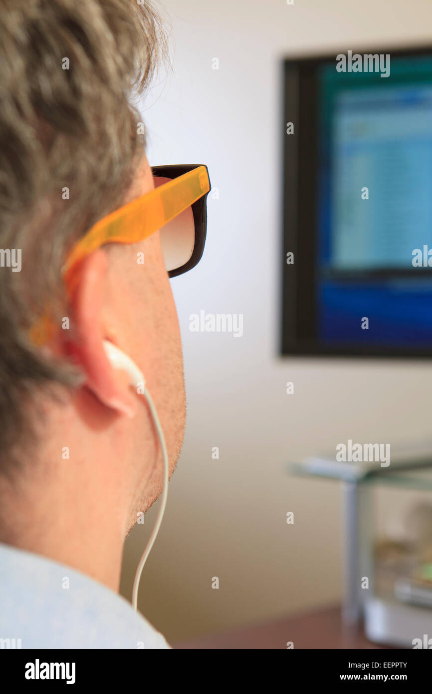 Man with congenital blindness using assistive technology at his ...