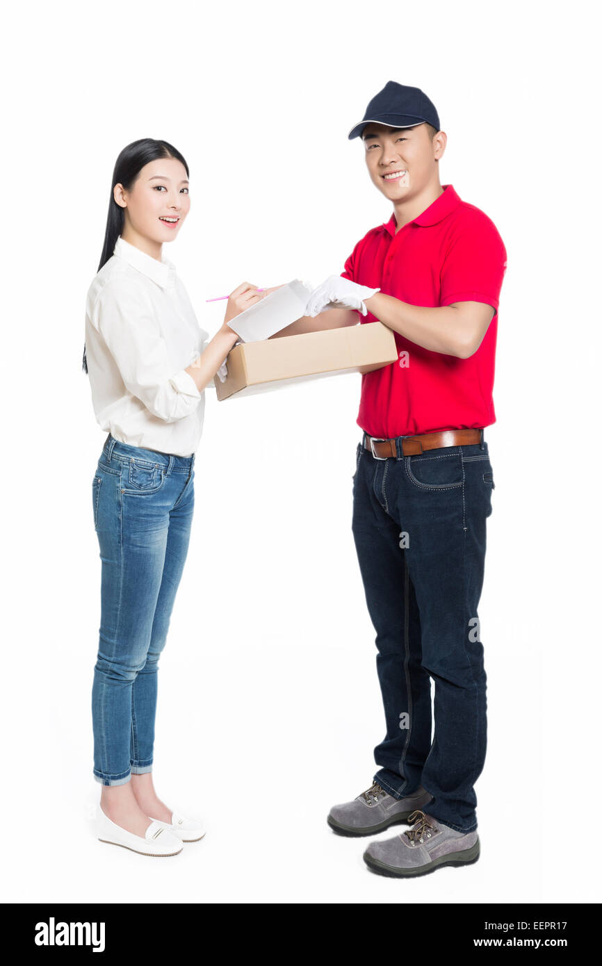 young courier deliver package to pretty woman, white background Stock ...