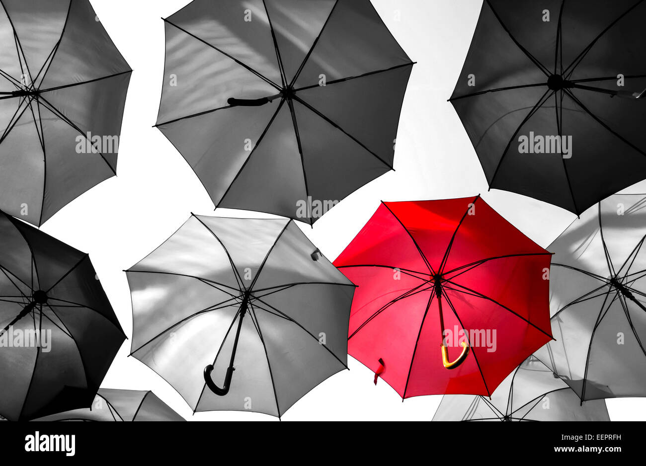 red umbrella standing out from the crowd Stock Photo - Alamy