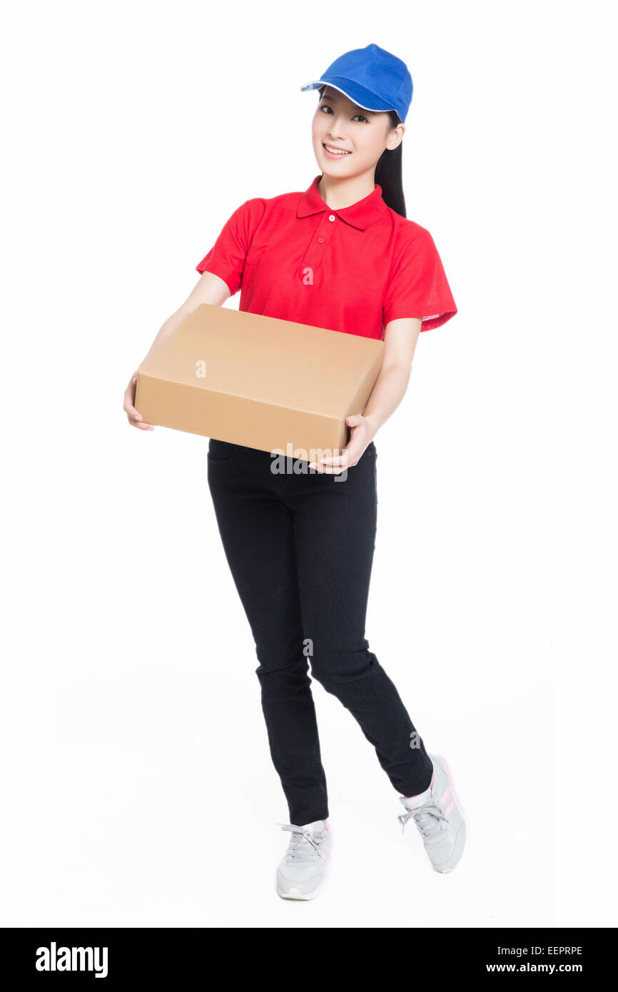 delivery woman carrying cardboard box, white background Stock Photo - Alamy