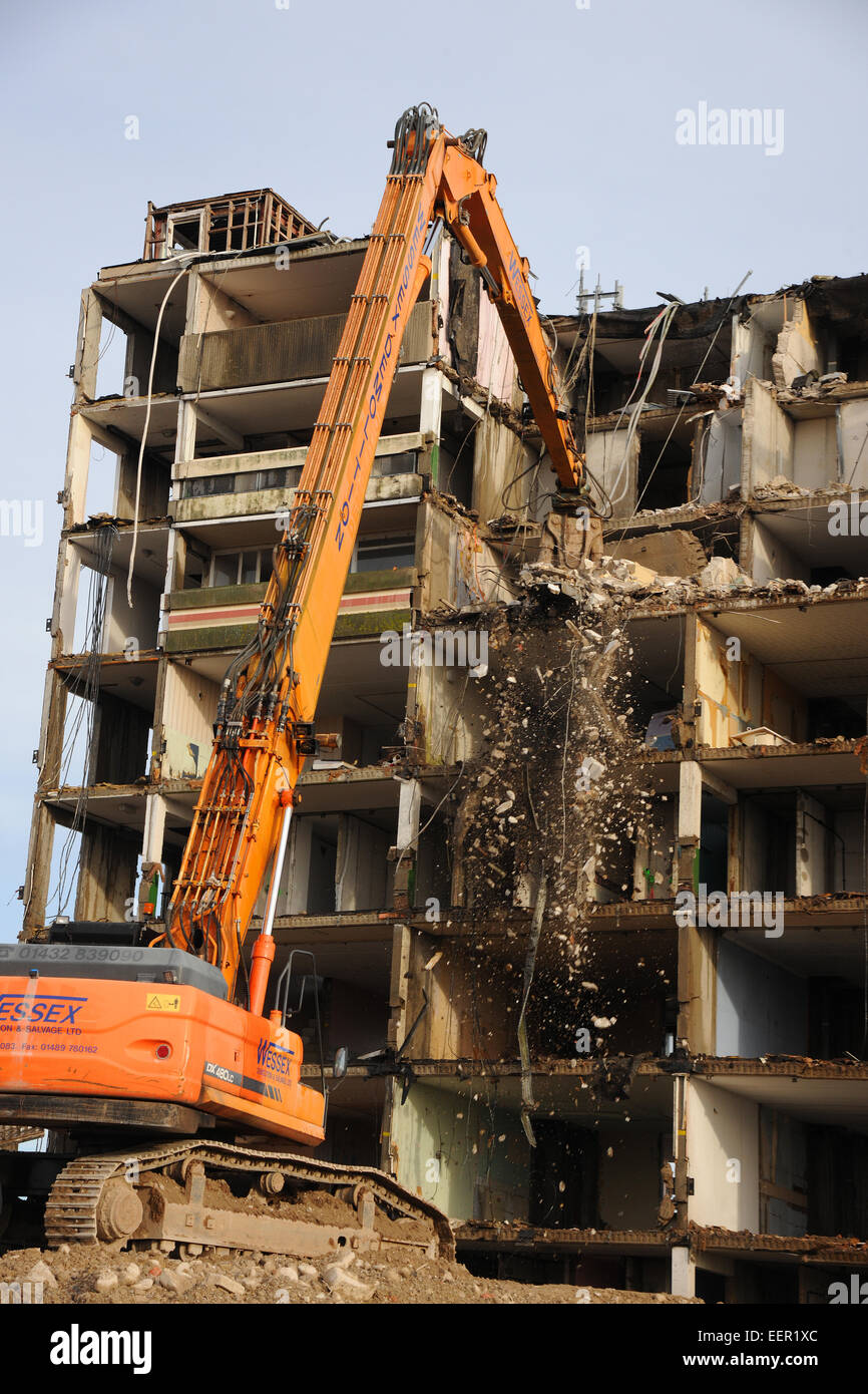 Debris falls from an upper storey as an apartment block is turned ...
