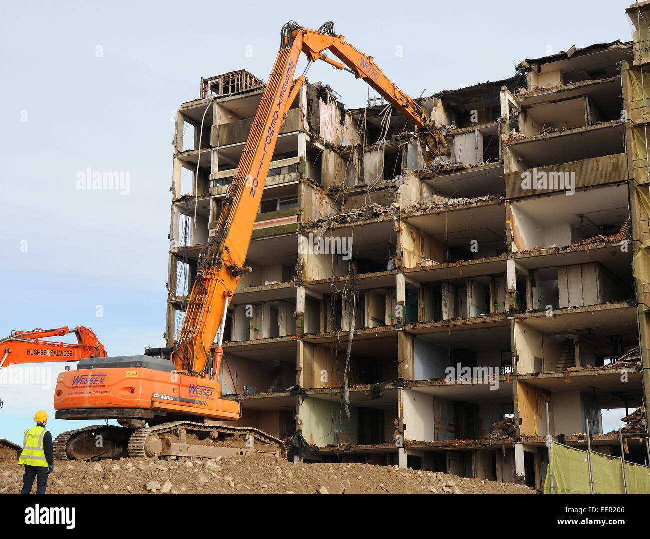 Debris falls from an upper storey as an apartment block is turned ...