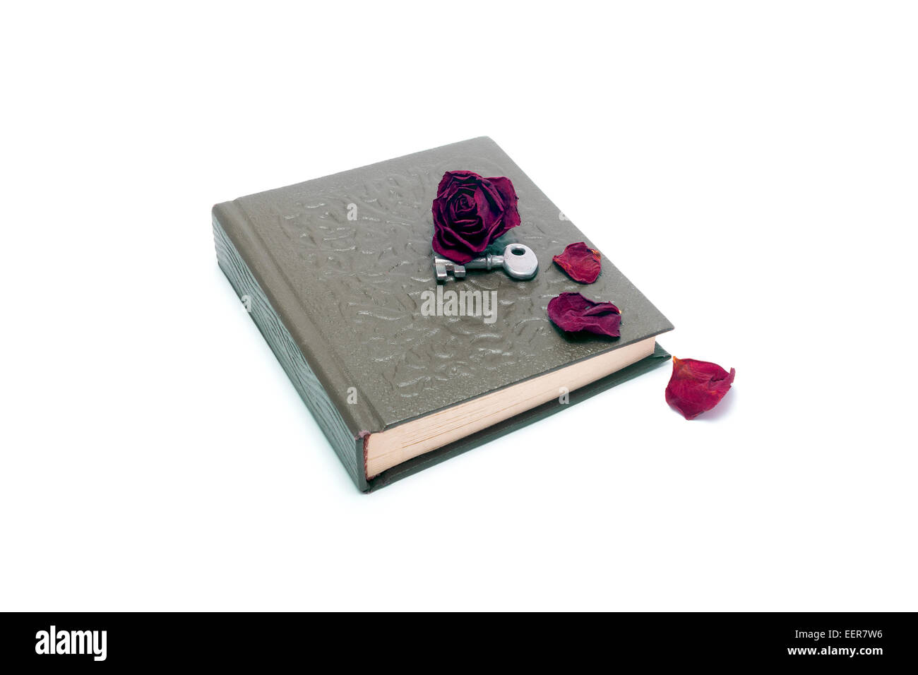 Dried rose with a key on the old book Stock Photo - Alamy