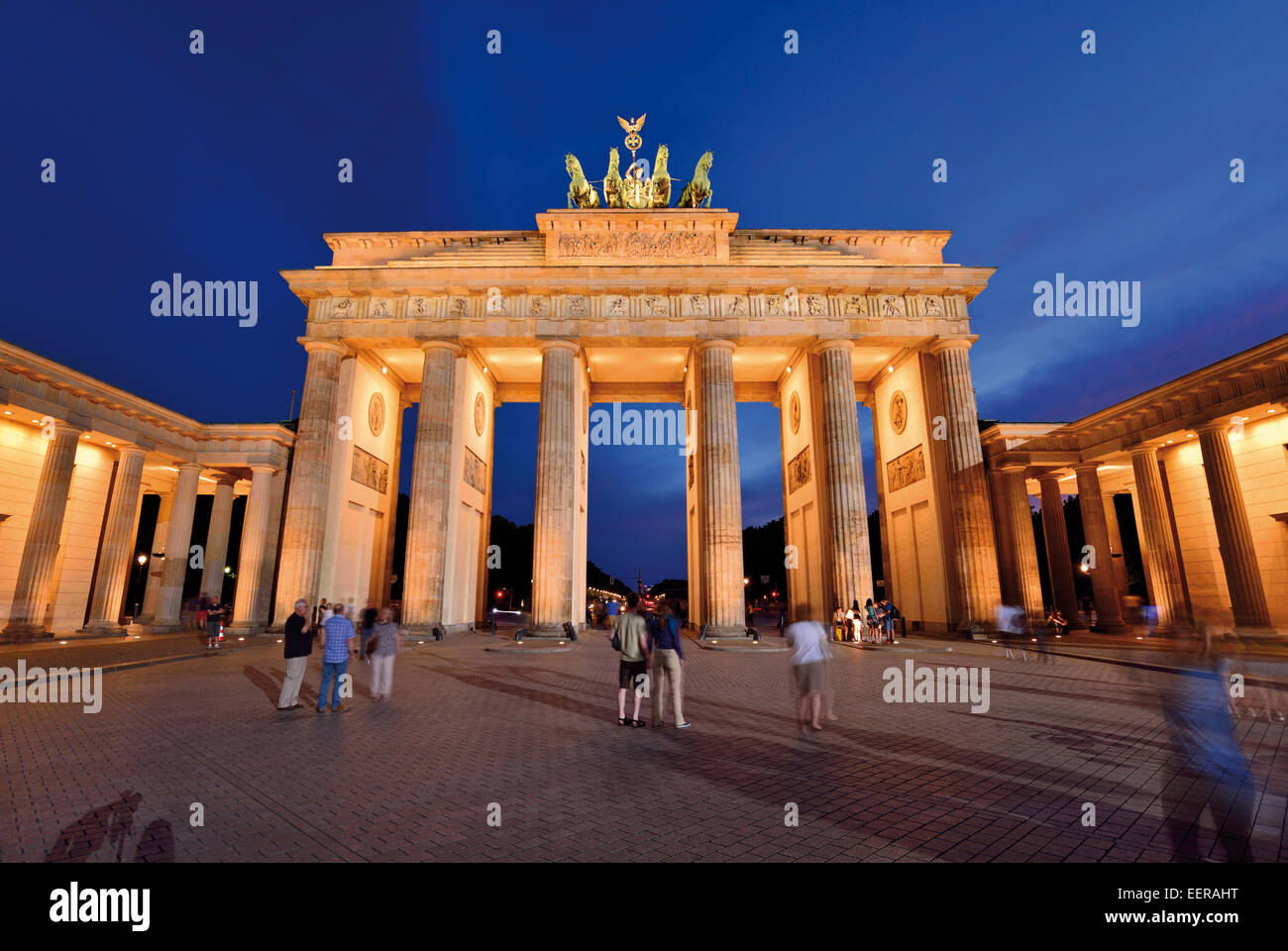 Germany, Berlin: Tourists taking nocturnal snapshots at the Brandenburg ...