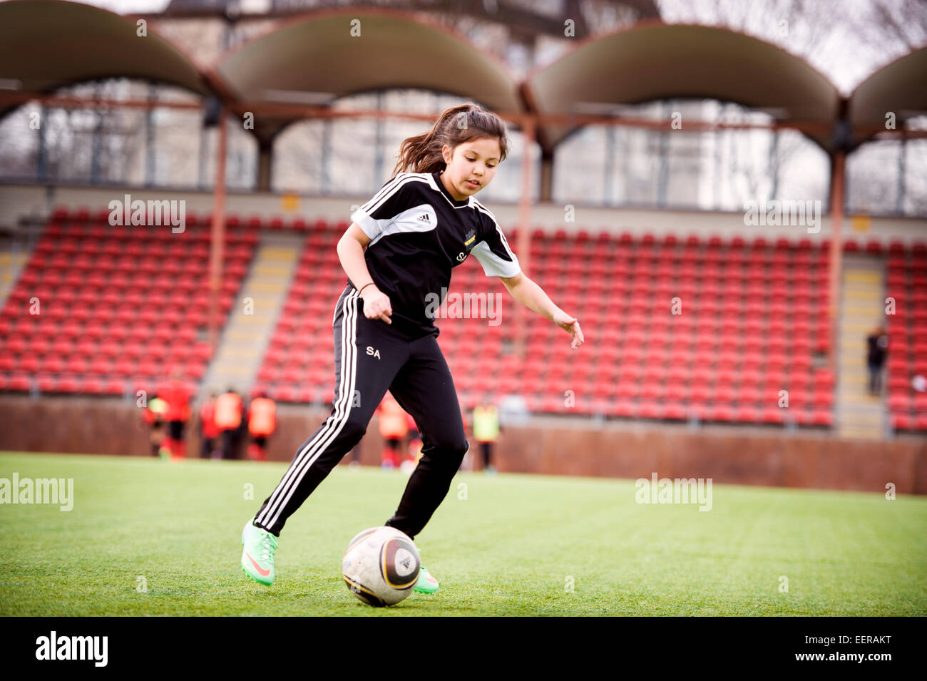 Football girl playing hi-res stock photography and images - Alamy