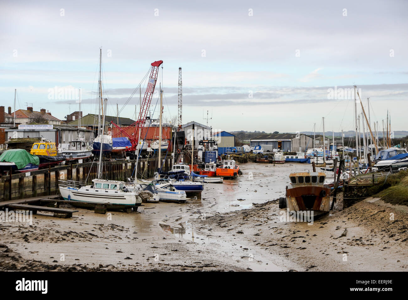 Newhaven East Sussex UK - Harbour quay wharf at low tide with boats ...