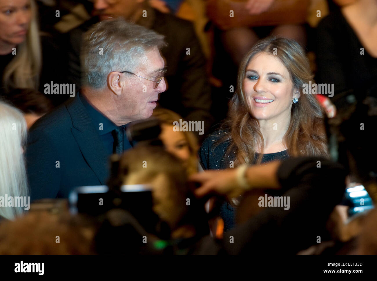 British actress Elizabeth Hurley talks to the owner of fashion label ...