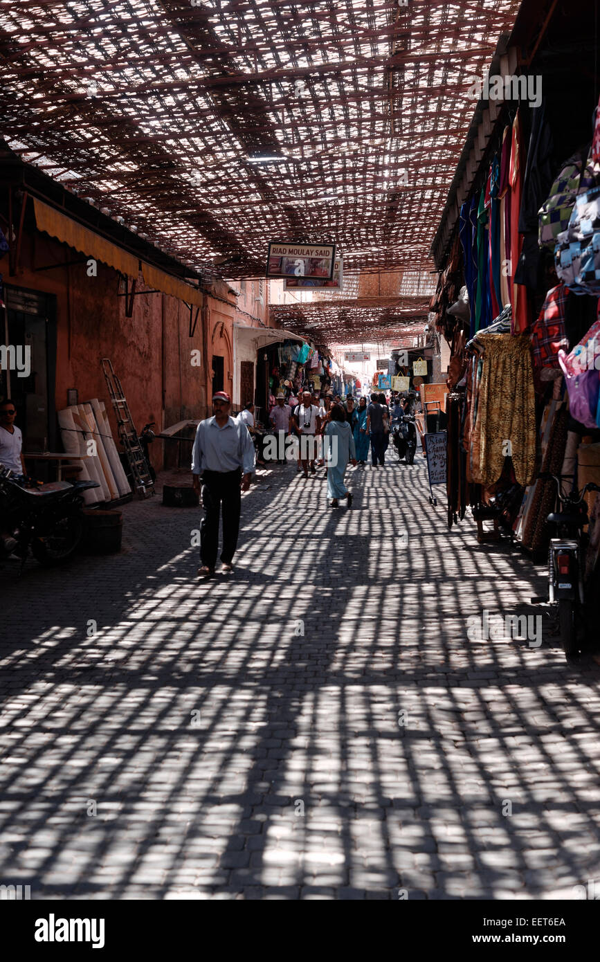 Canopies of wood generate shade and patterns on light on the market ...